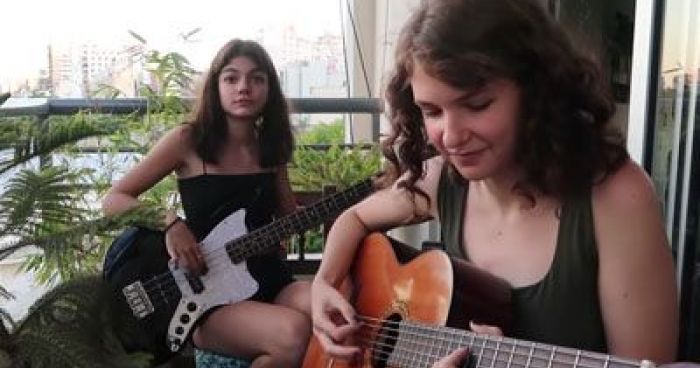 Two Girls Rocking Out To The Strokes On A Balcony | Klipland.com