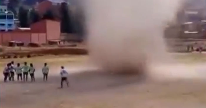 Dust Devil Rolls Its Way Across A Field During A Soccer Game | Klipland.com