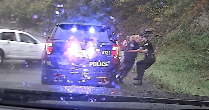 Quick Acting Cop Saves Co Worker From Oncoming Car